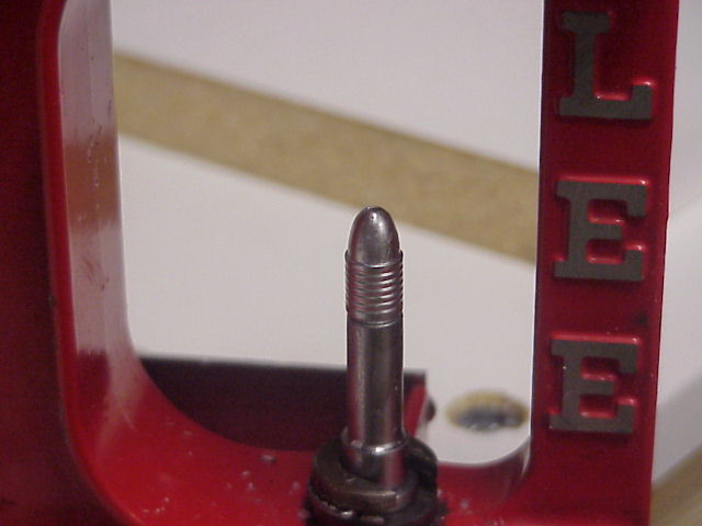 Here's the bullet, sitting on the punch, ready to go up into the die.